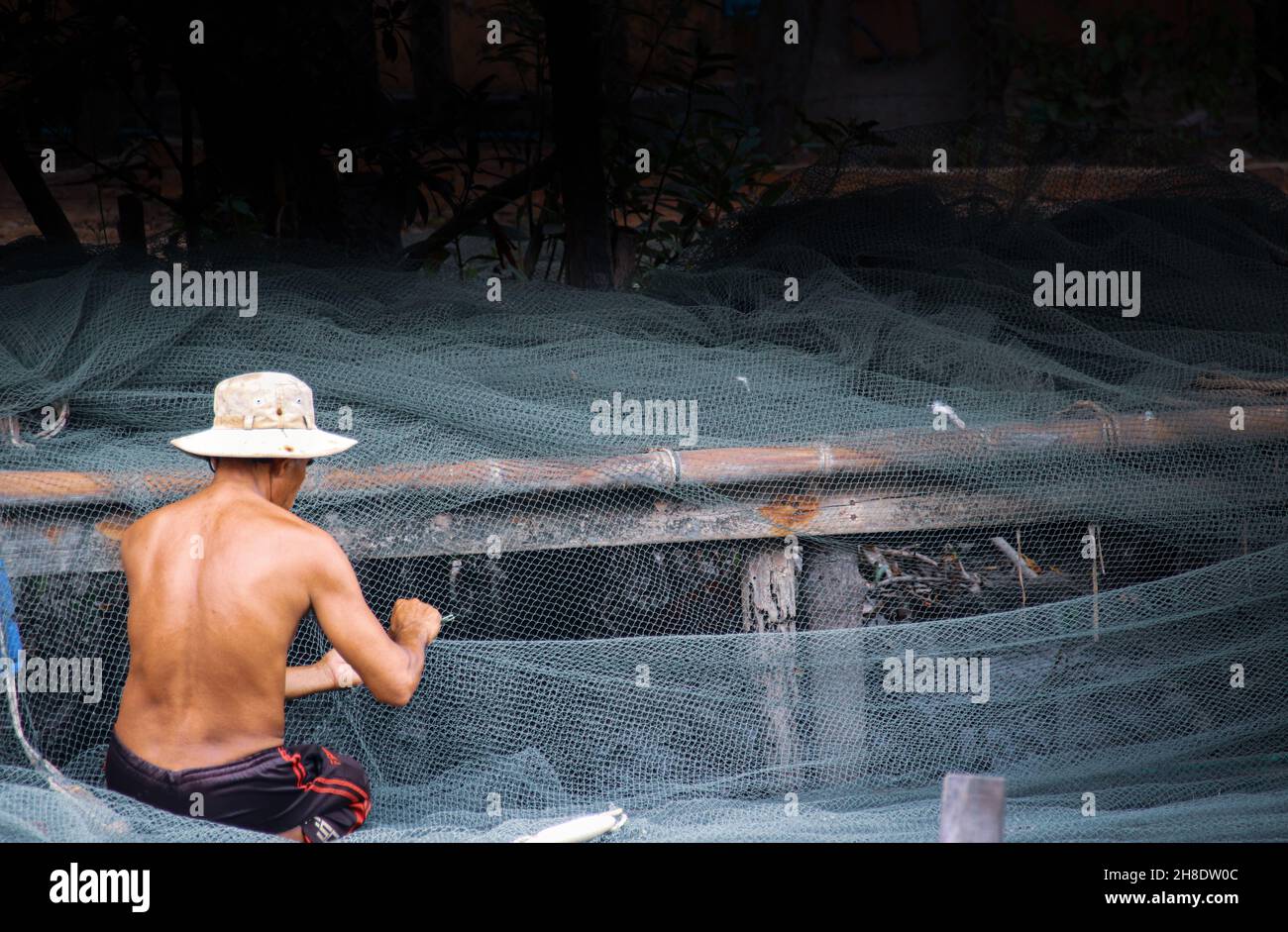 Fixing a fishing boat hi-res stock photography and images - Alamy