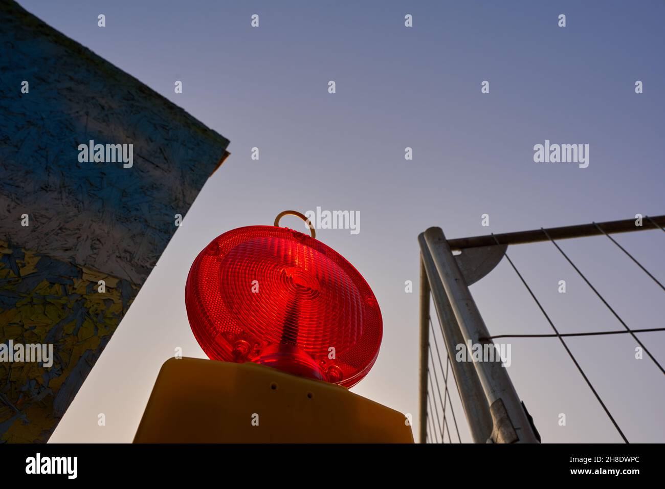 Warning light (Warnleuchte) of a construction site in the early morning ...