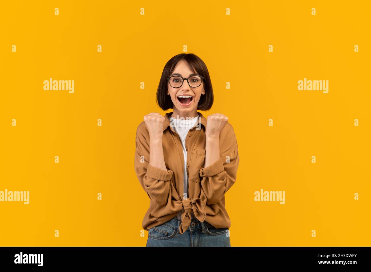 Yes, I did it. Overjoyed caucasian woman gesturing yes in joy ...