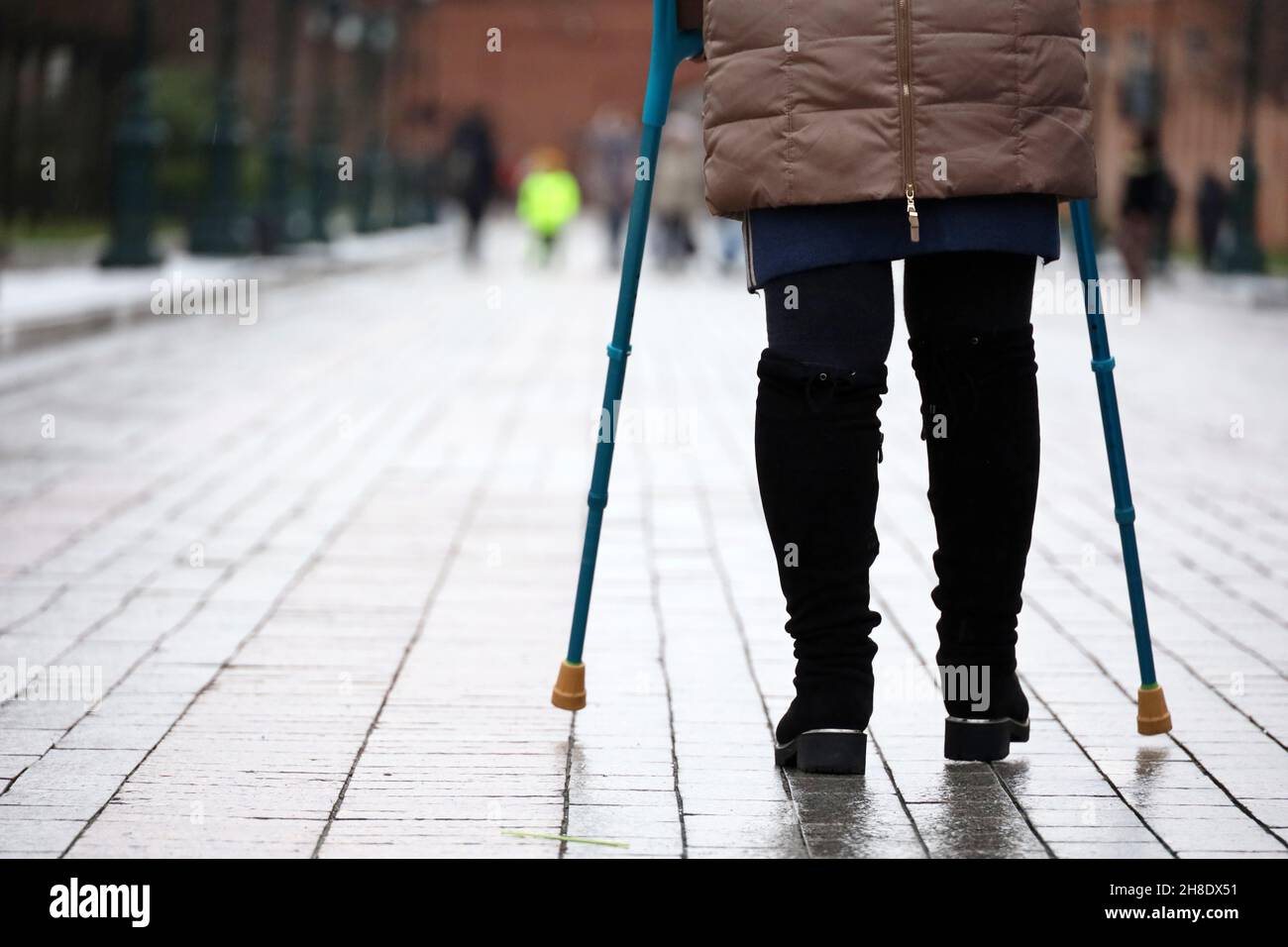 Woman crutches disabled hi-res stock photography and images - Alamy