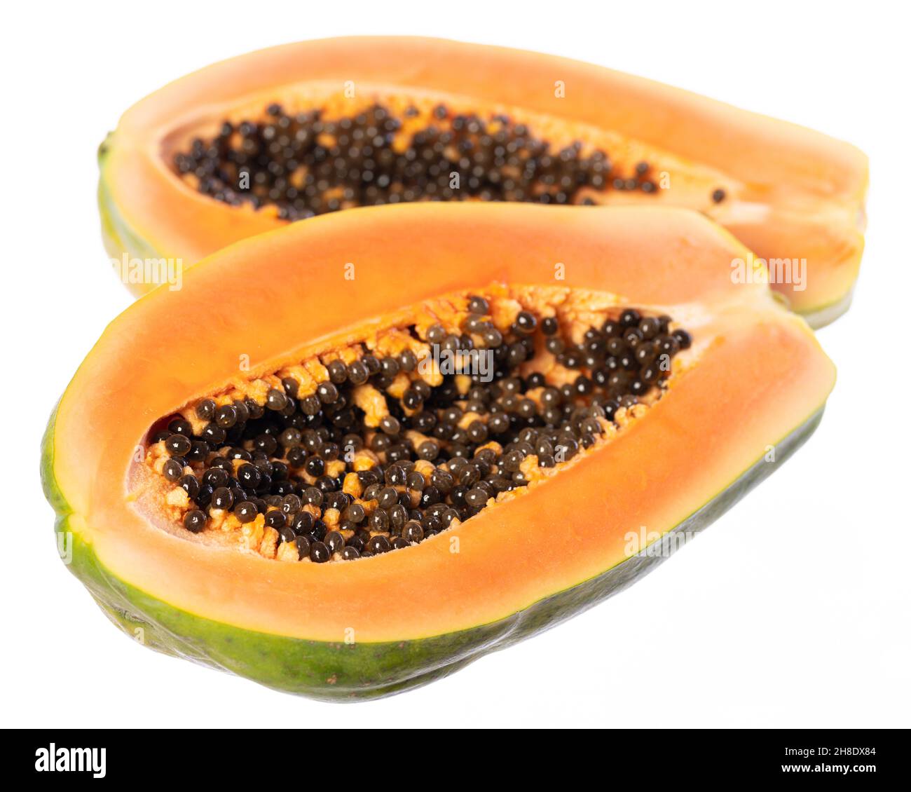 two halfs of papaya with kernels isolated on white background Stock ...