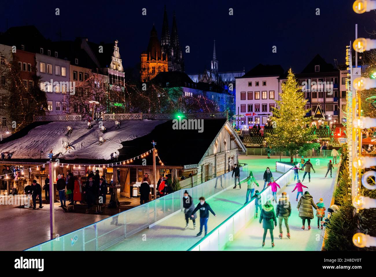 Cologne, Germany. 29th Nov, 2021. Visitors skate on an ice rink at the ...