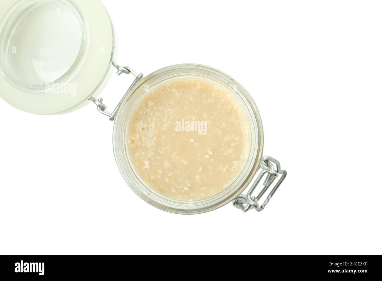 Tahini sauce in a jar isolated on white background Stock Photo - Alamy