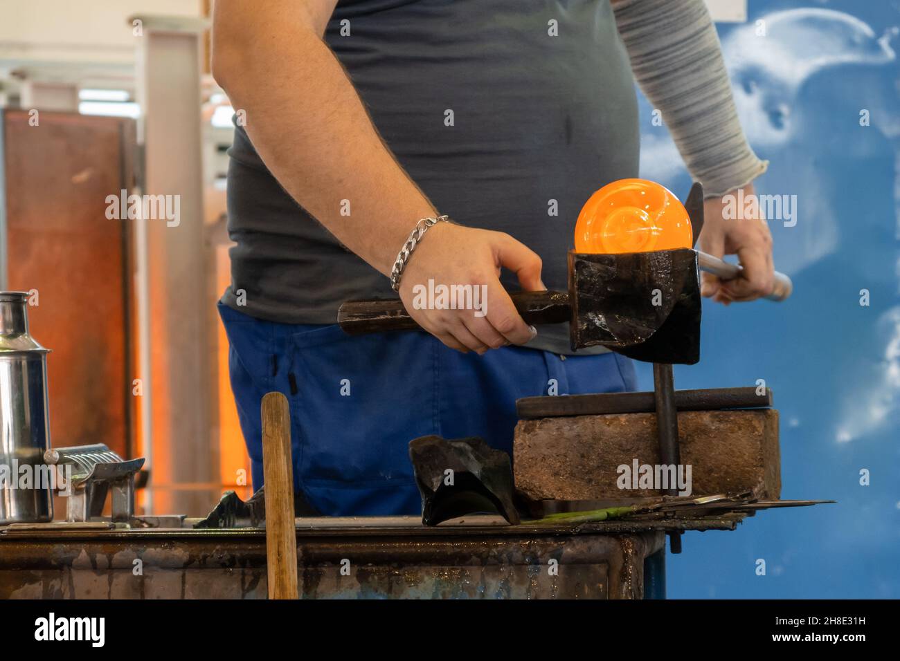 Manual glass production by glassblowing by worker at the factory Stock ...