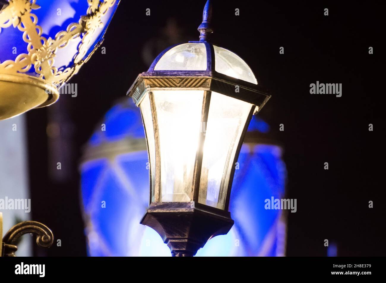 Vintage street lights at night with blue patterned scenery Stock Photo ...