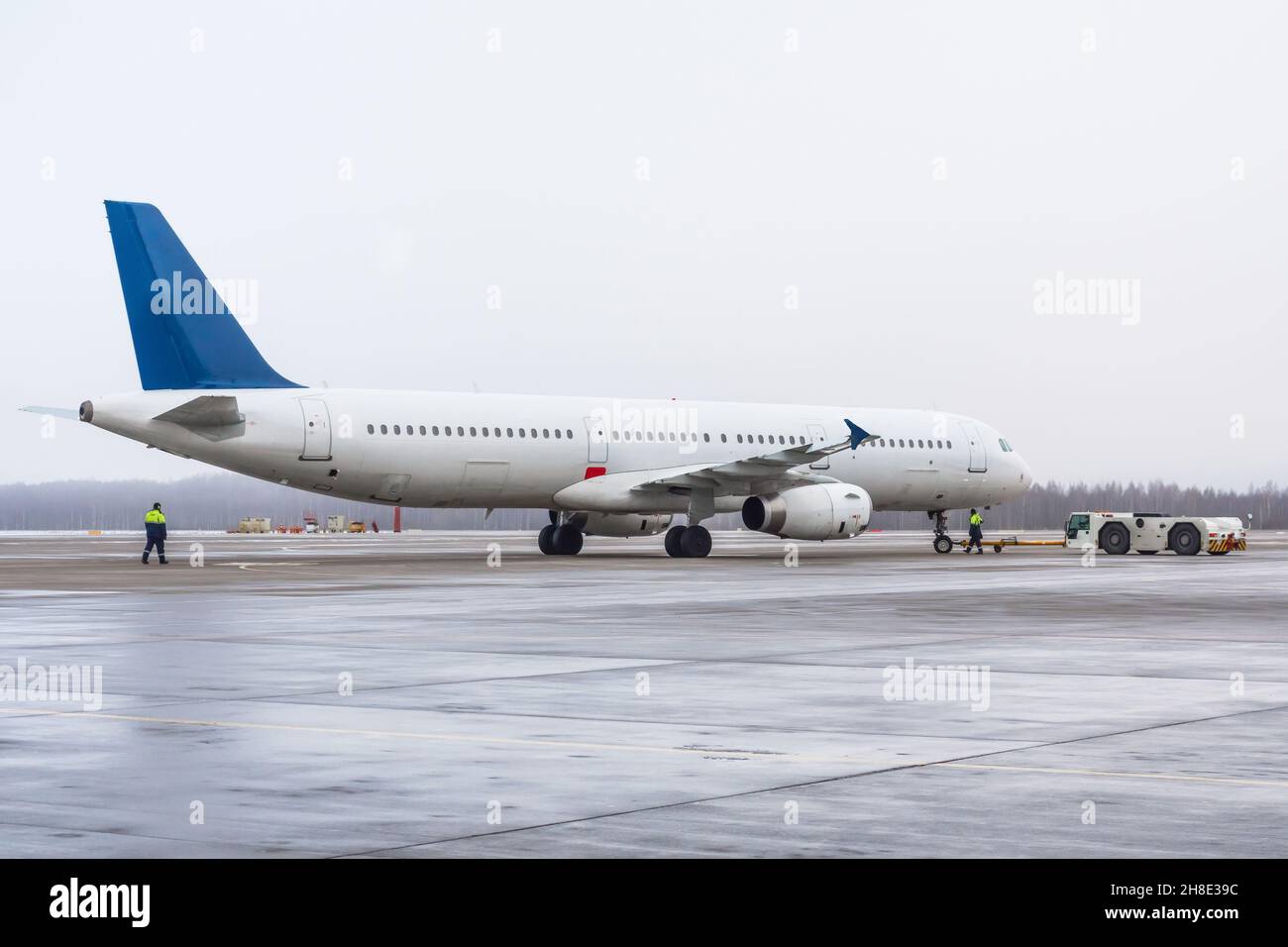 Commercial passenger airplane during push back operation Stock Photo ...