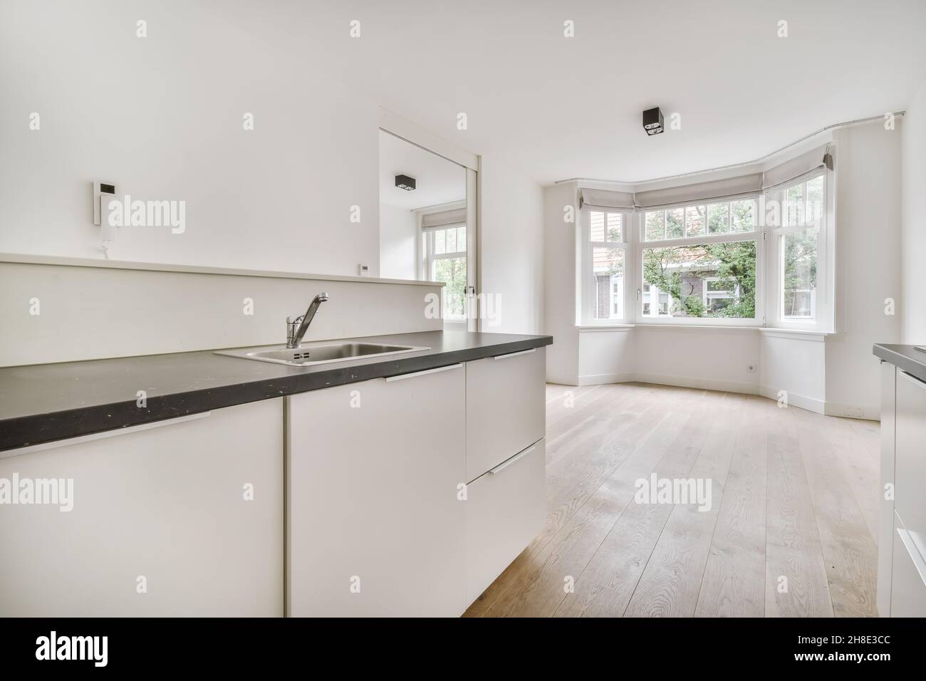 The interior of the kitchen area with a snow-white kitchen set Stock ...