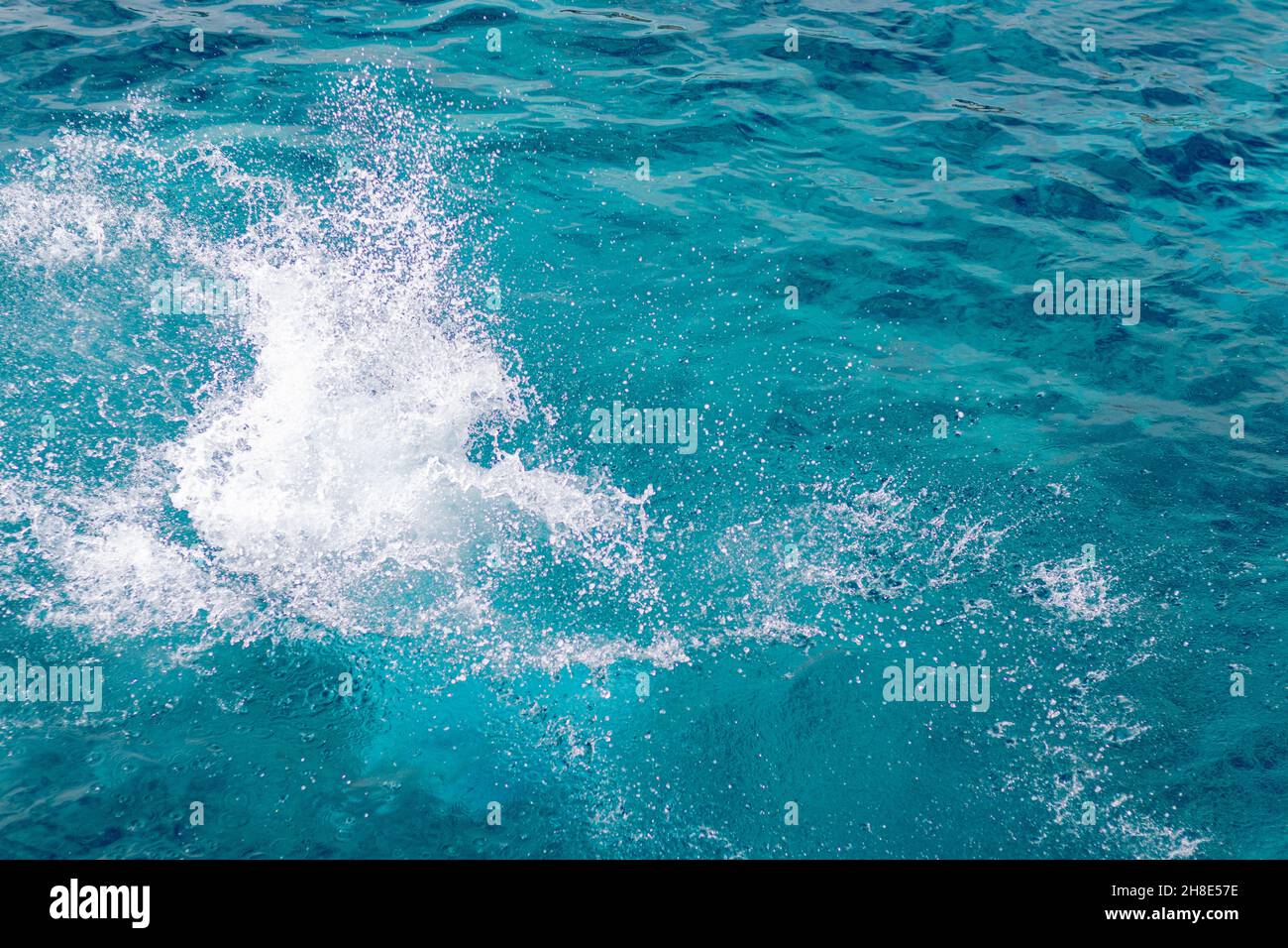 Splashes of blue, sea water with foam bubbles. A splash of nature on a ...