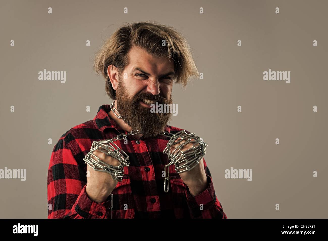 man has heavy steel chain on neck. conceptual symbol of freedom. male ...