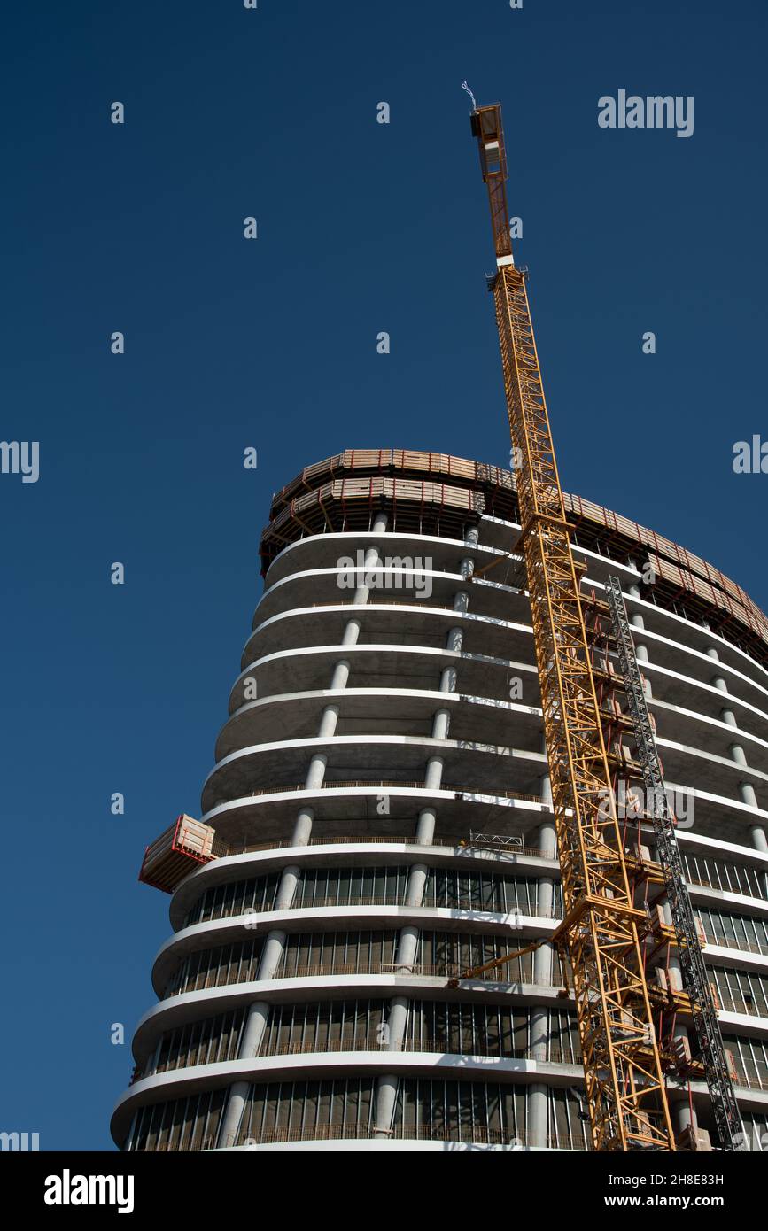 Residential office building construction site and cranes during a ...