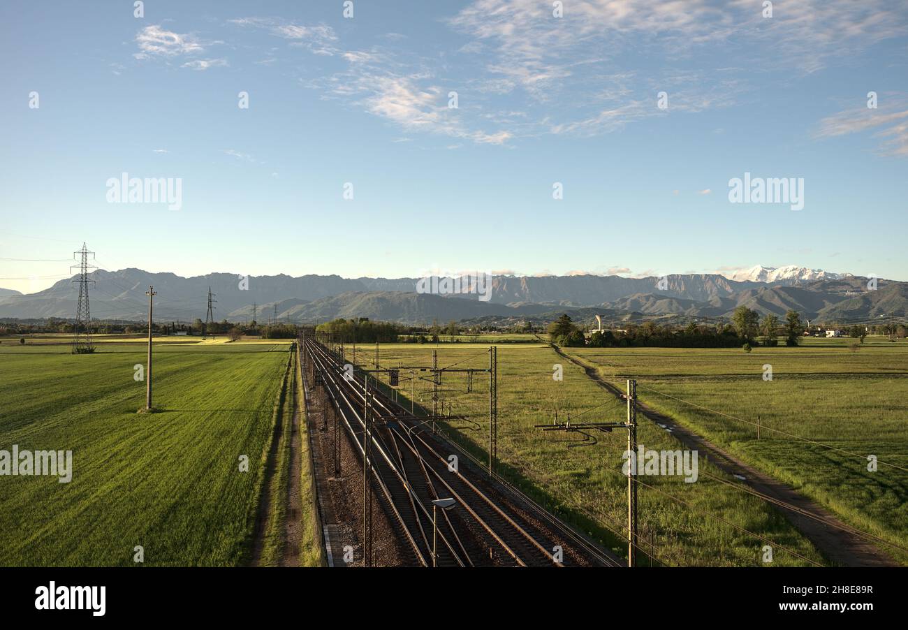 Aerial view of a green field and railroads during daylight Stock Photo ...