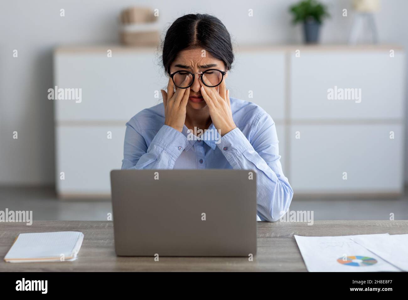 Tired sad young indian business woman suffering from headache, fatigue ...
