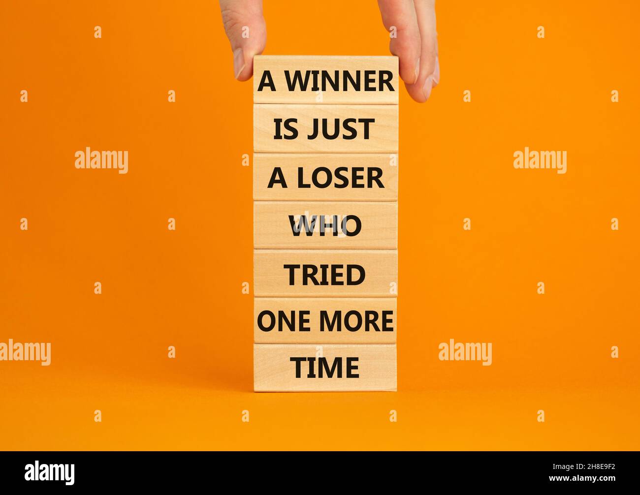 Winner or loser symbol. Wooden blocks with words A winner is just a ... Winner or loser symbol. Wooden blocks with words A winner is just a ...