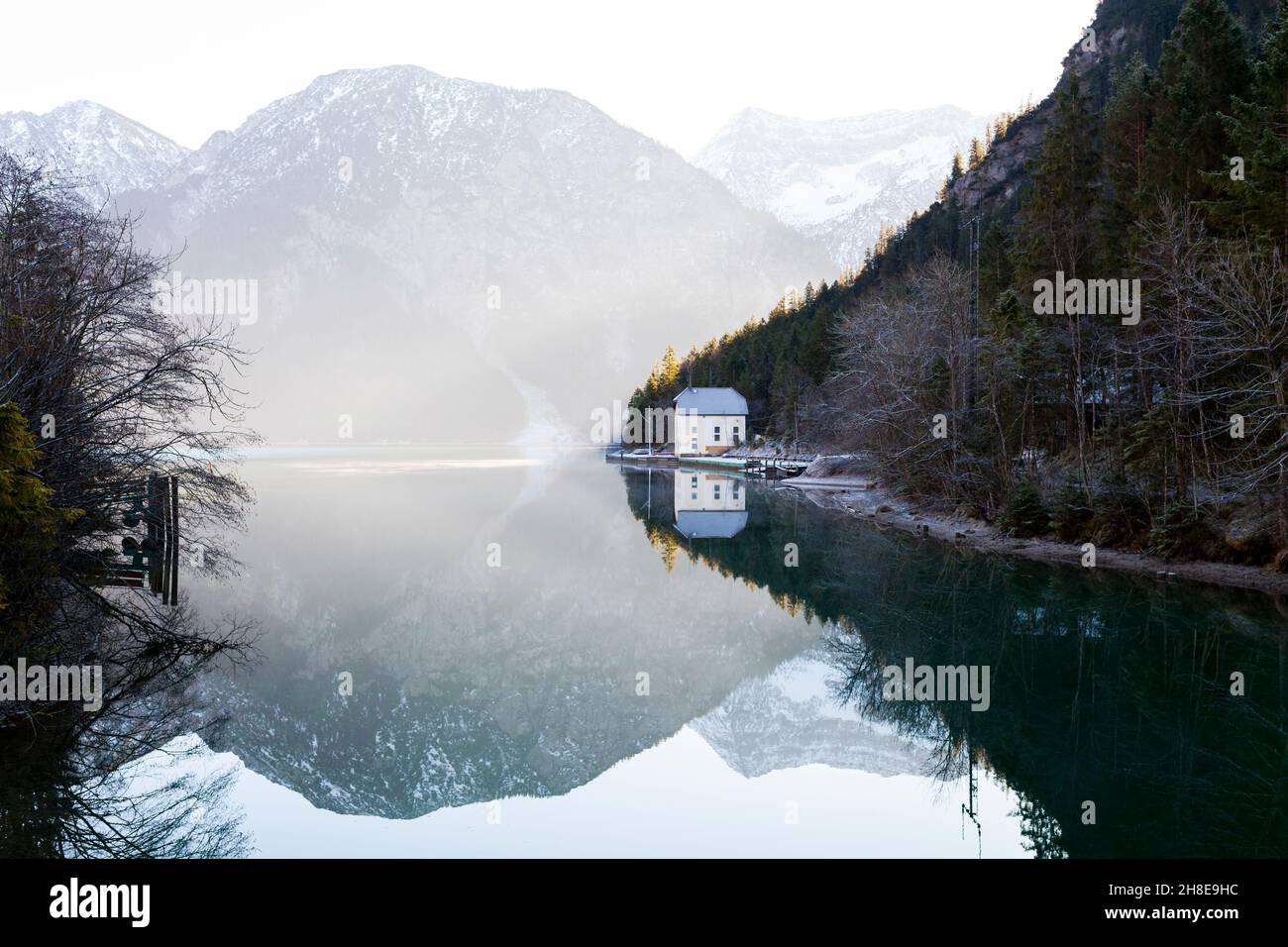 Winter reflection on a austrian lake Stock Photo - Alamy