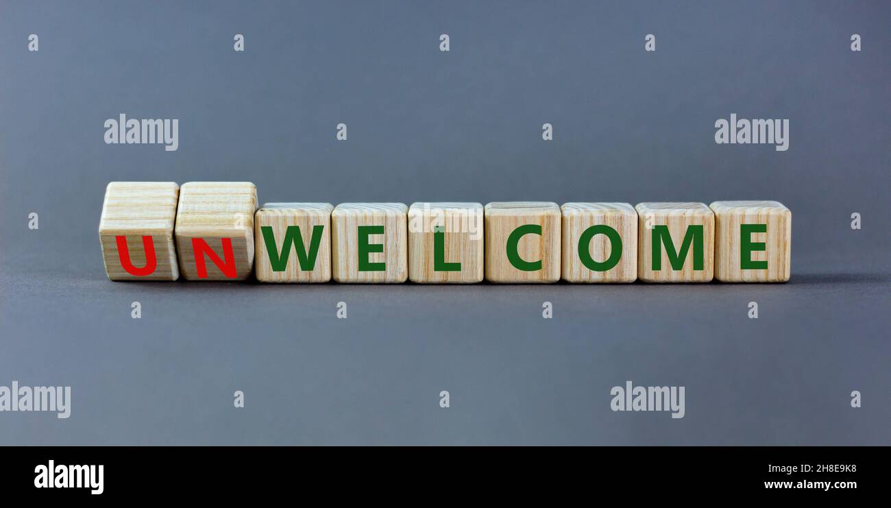Welcome or unwelcome symbol. Turned wooden cubes and changed the word ...