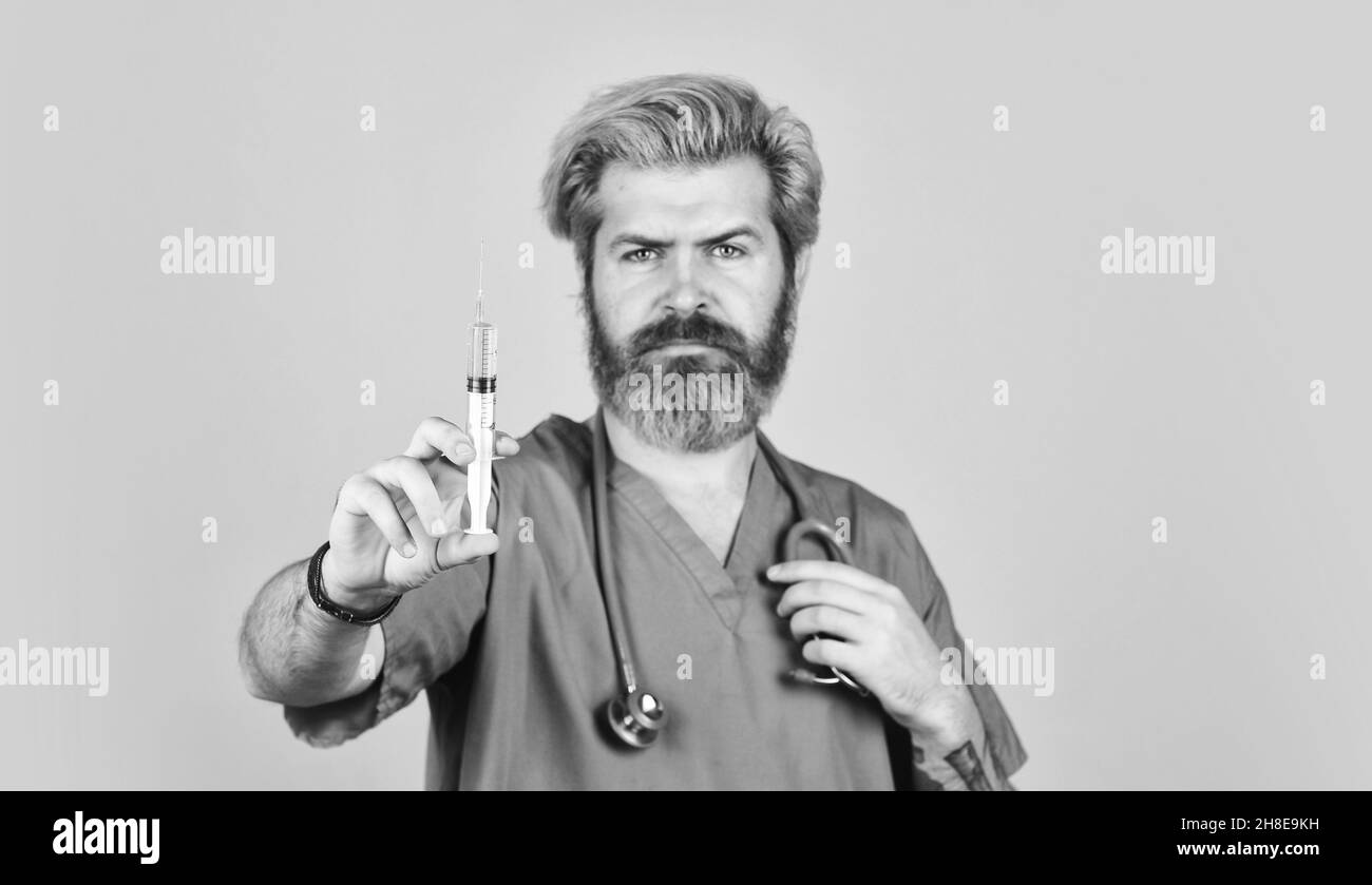 Doctor advertising your product. mature doctor use syringe, selective ...