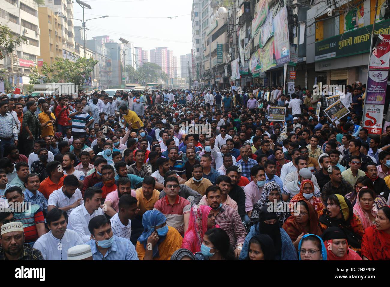 Activists of the Bangladesh Nationalist Party (BNP) sit on road during ...