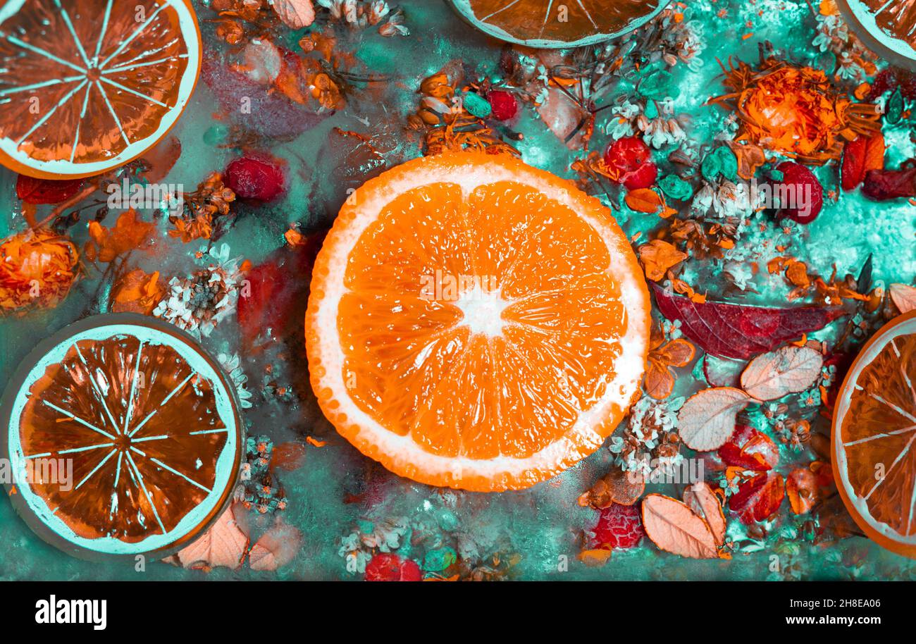 Colorful Fruit pattern of fresh citrus fruits on turquoise ice ...