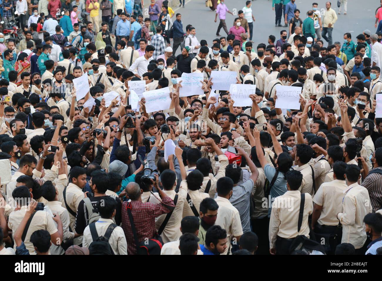 Students block road as they protest demanding safety on roads following ...