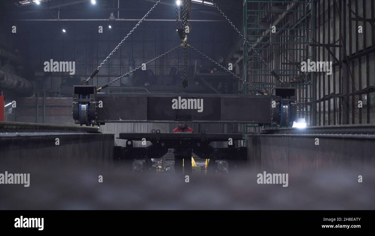 Wagon platform stands on rails at factory. Clip. Metal platform of ...