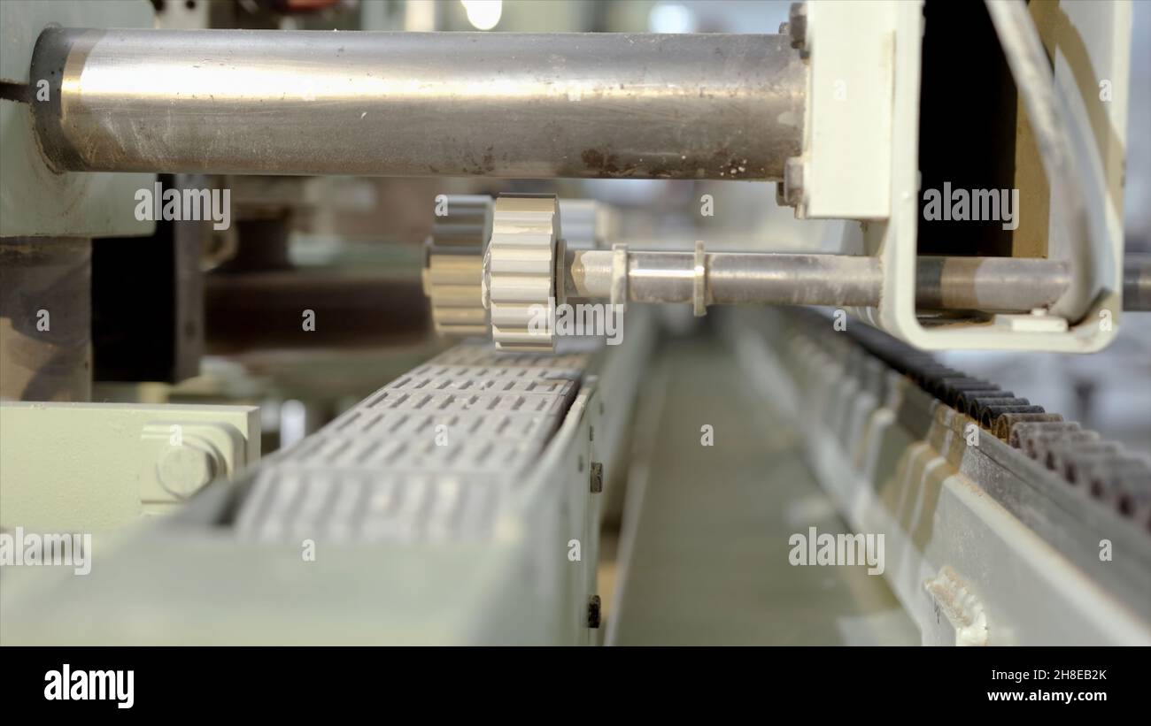 Conveyor moving parts hi-res stock photography and images - Alamy