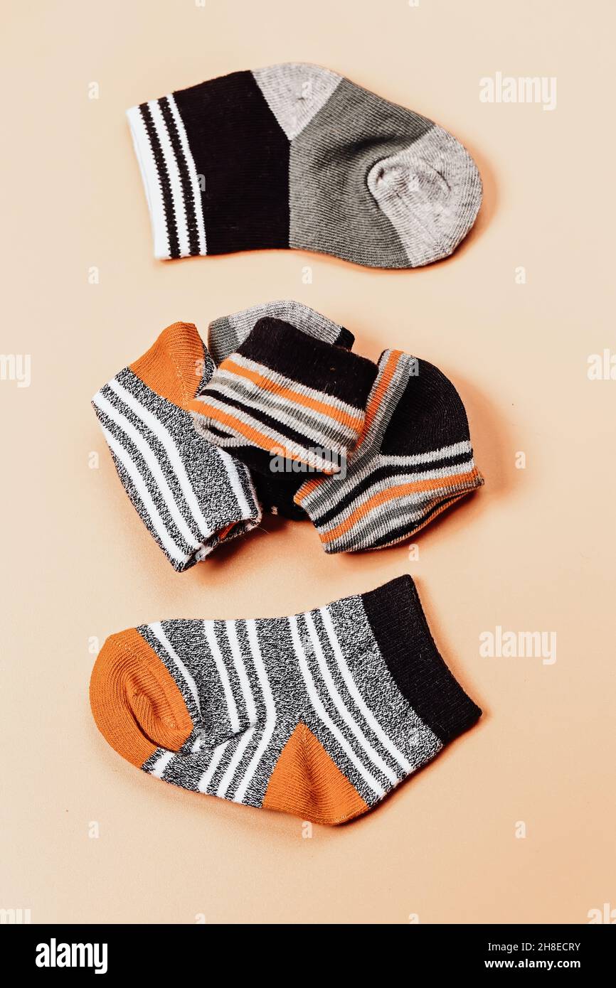 Different socks beige background with copy space. Flat lay. Top view ...