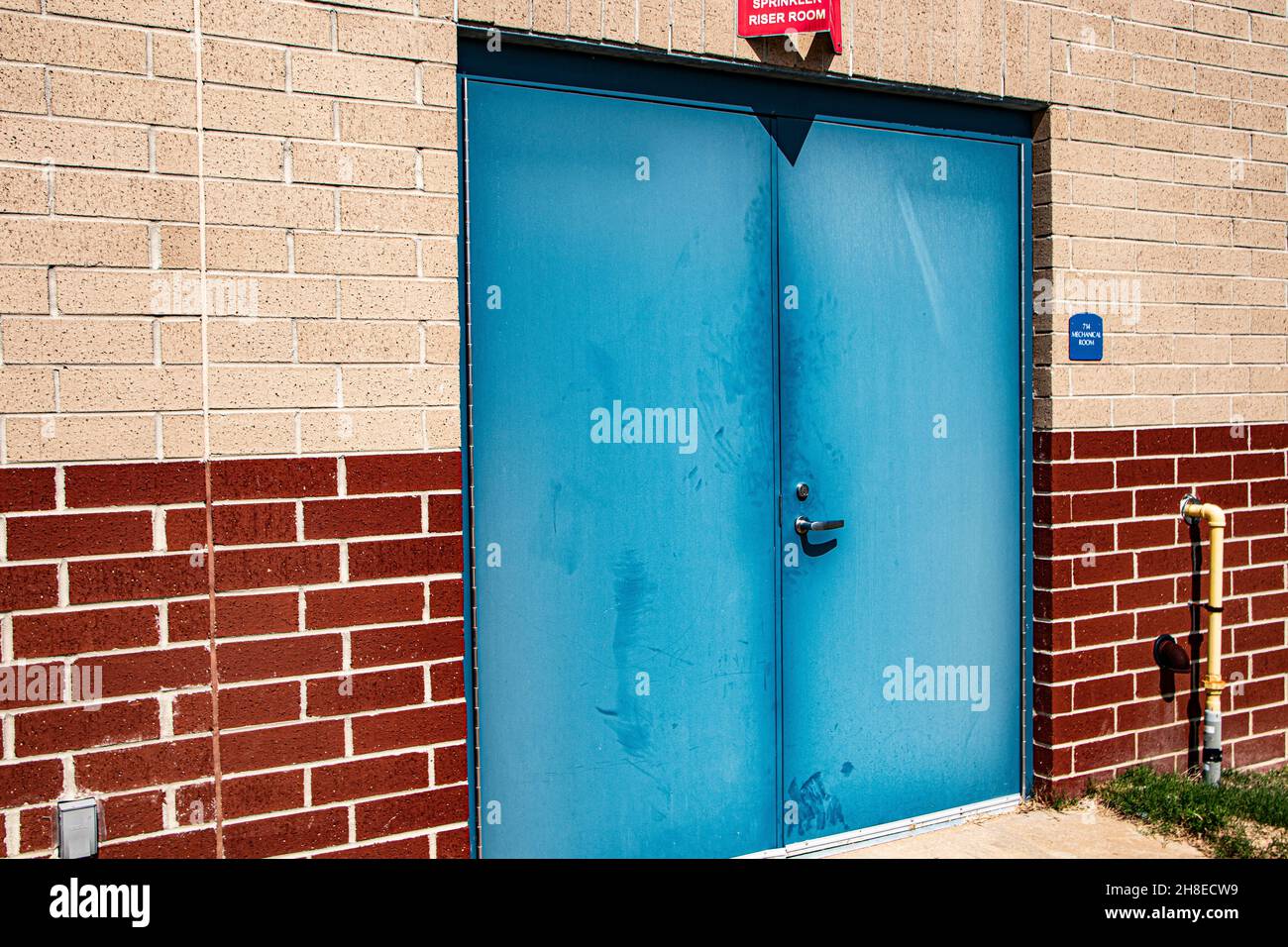 Blue steel doors exterior brick building in Georgia Stock Photo - Alamy