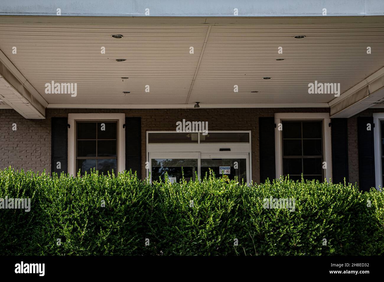 Entrance to a building with signs in glass windows in Georgia Stock ...