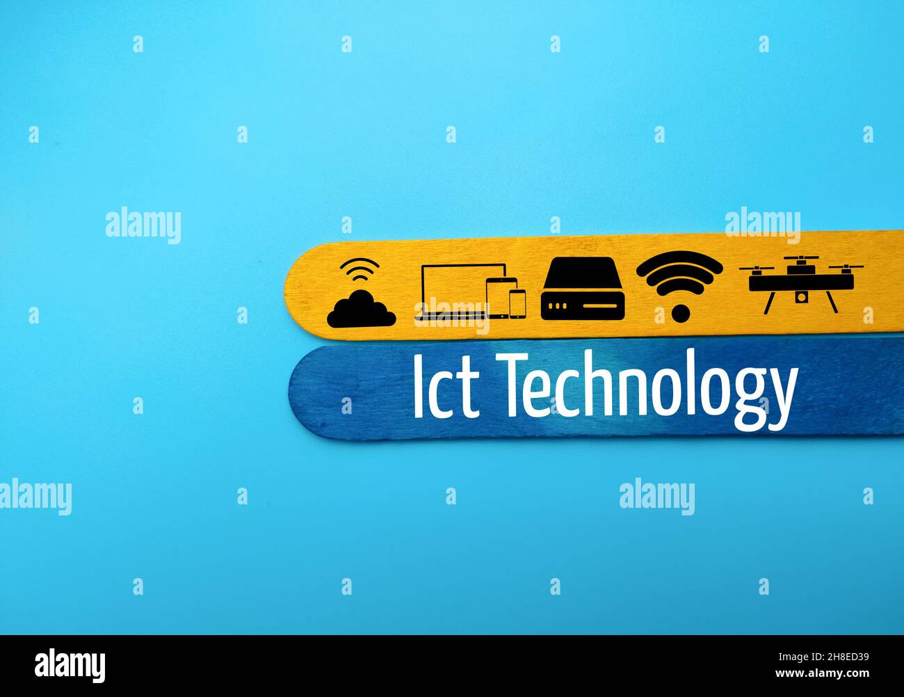 Close-up shot of blue and yellow wooden sticks with the "Ict Technology ...