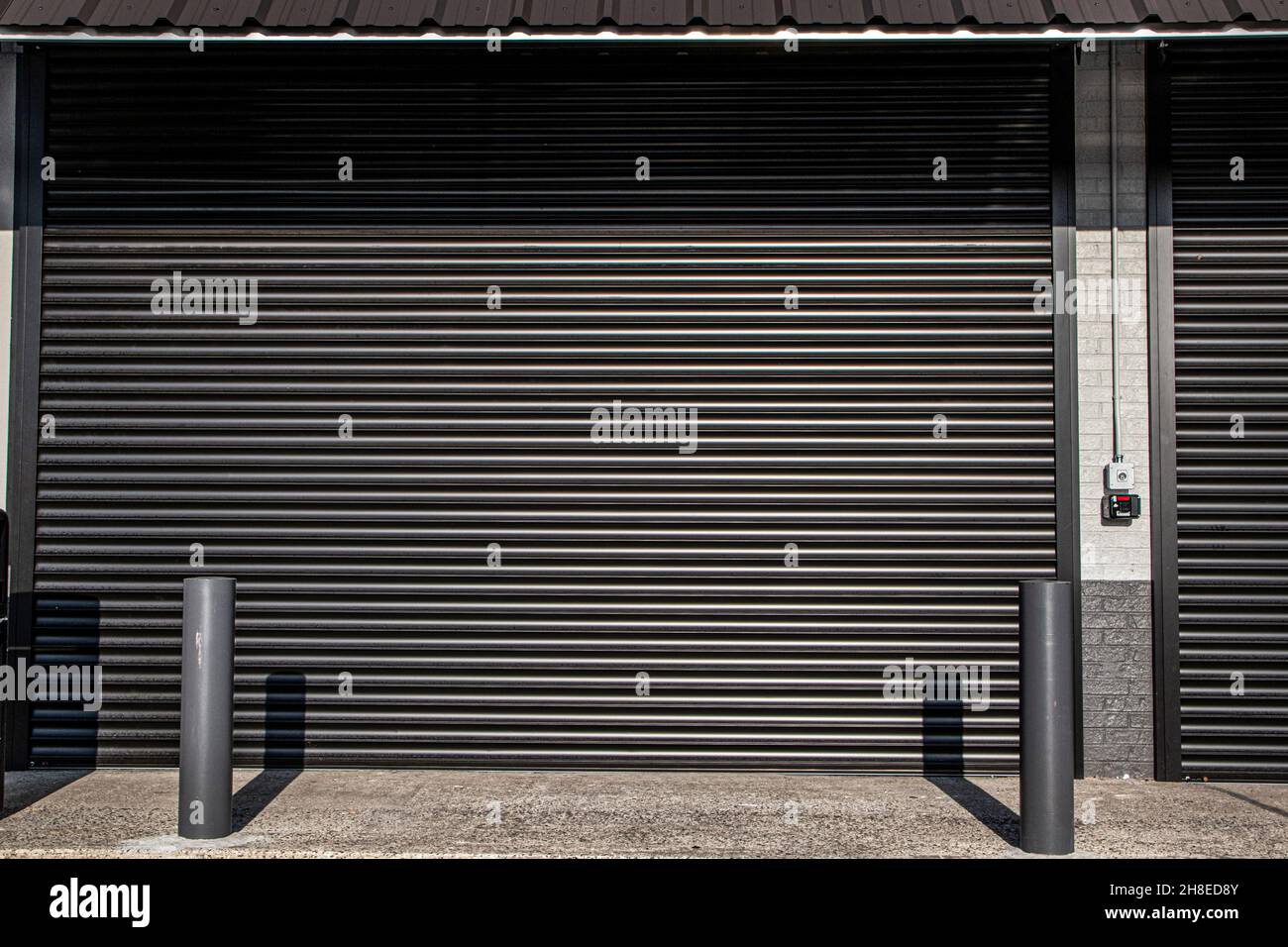 A roll down steel security door to protect a store in and urban area ...
