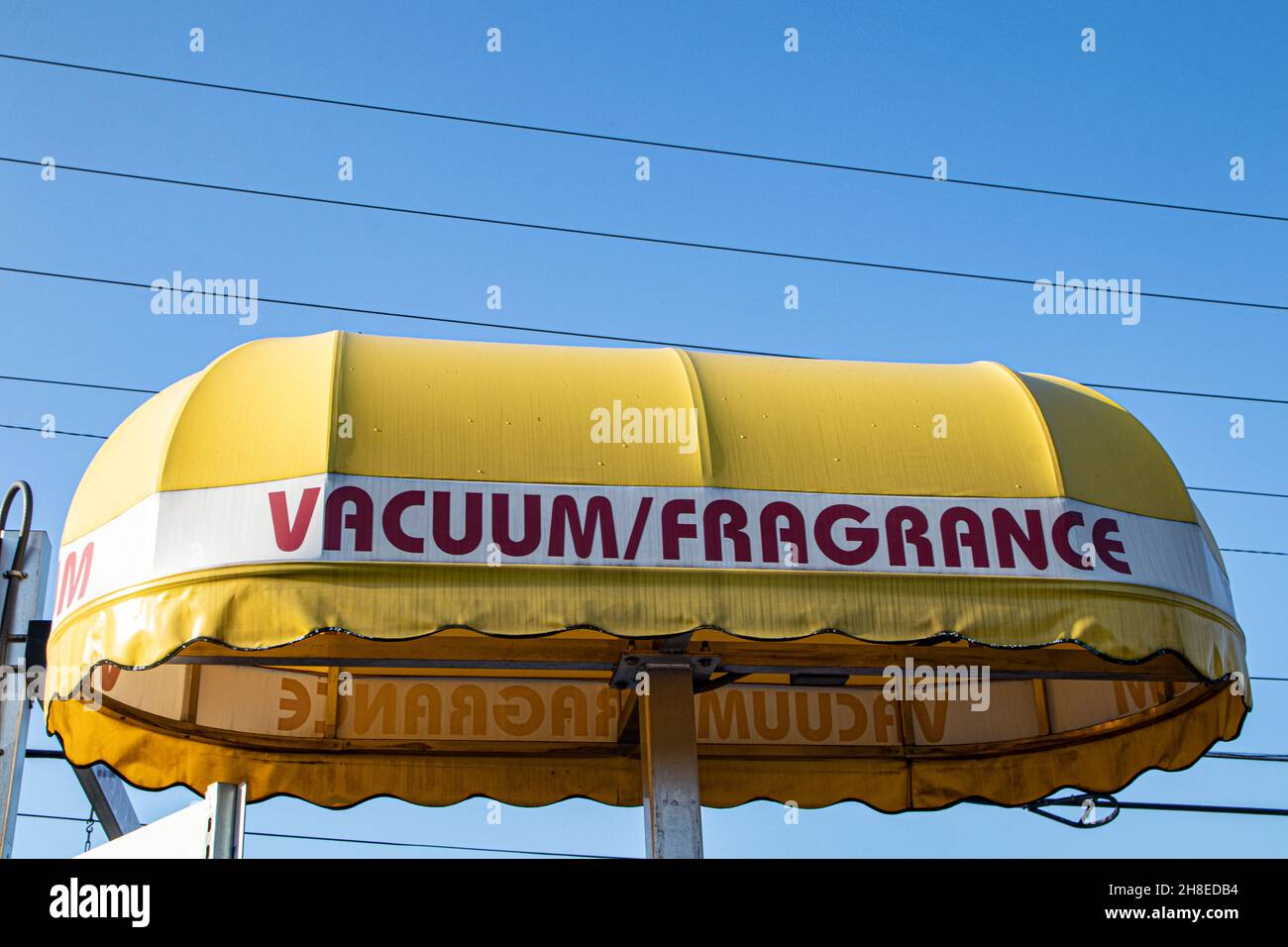 Vintage urban car wash umbrella Vacuum Fragrance sign Stock Photo - Alamy