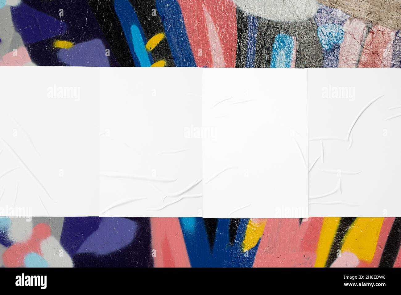 colorful urban wall texture with four wrinkled glued poster templates ...