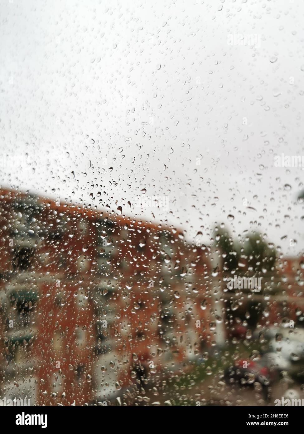 Glass window with many raindrops on it Stock Photo - Alamy