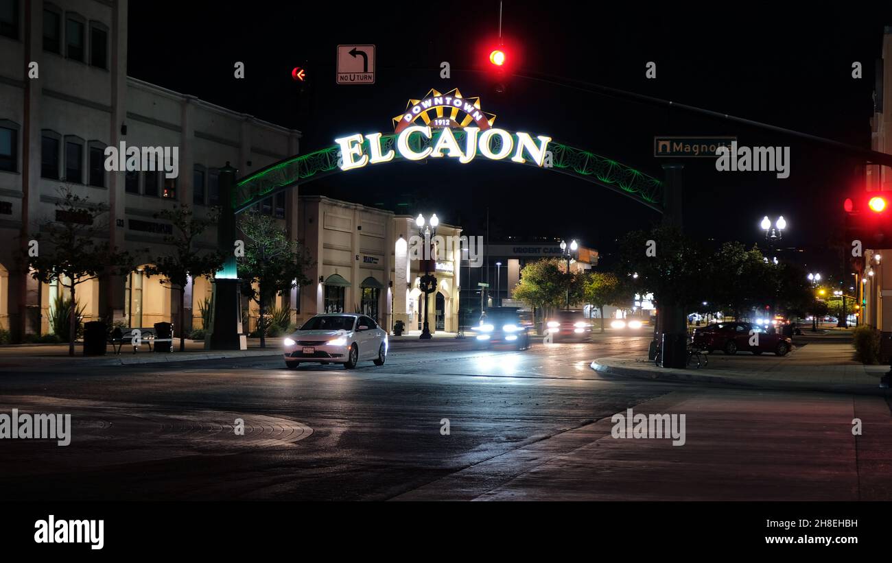 Downtown arch monument and neon sign at night, on the corner of ...