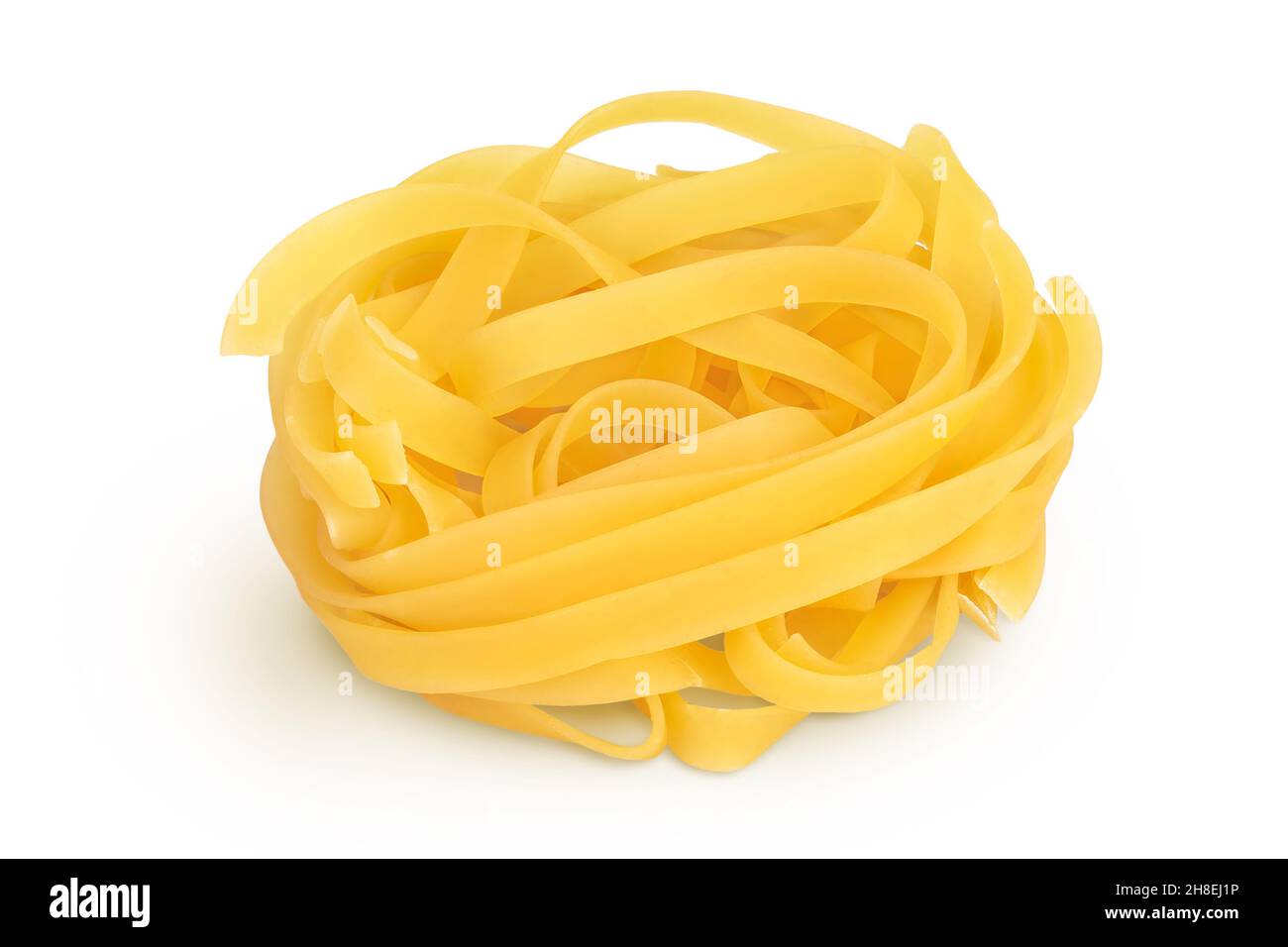 Raw tagliatelle pasta isolated on white background with clipping path ...