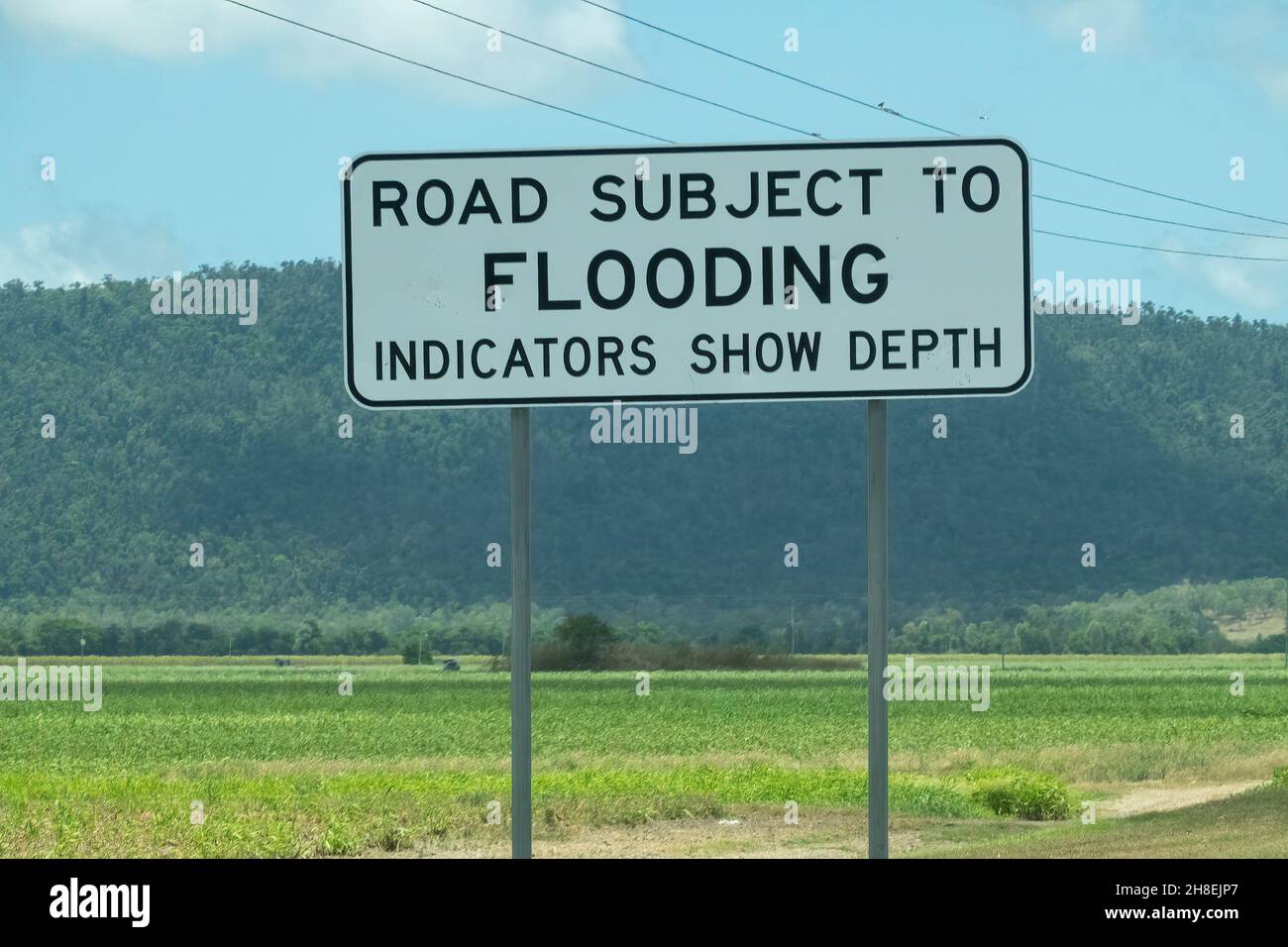 Road sign warning road subject to flooding, indicators show depth Stock ...