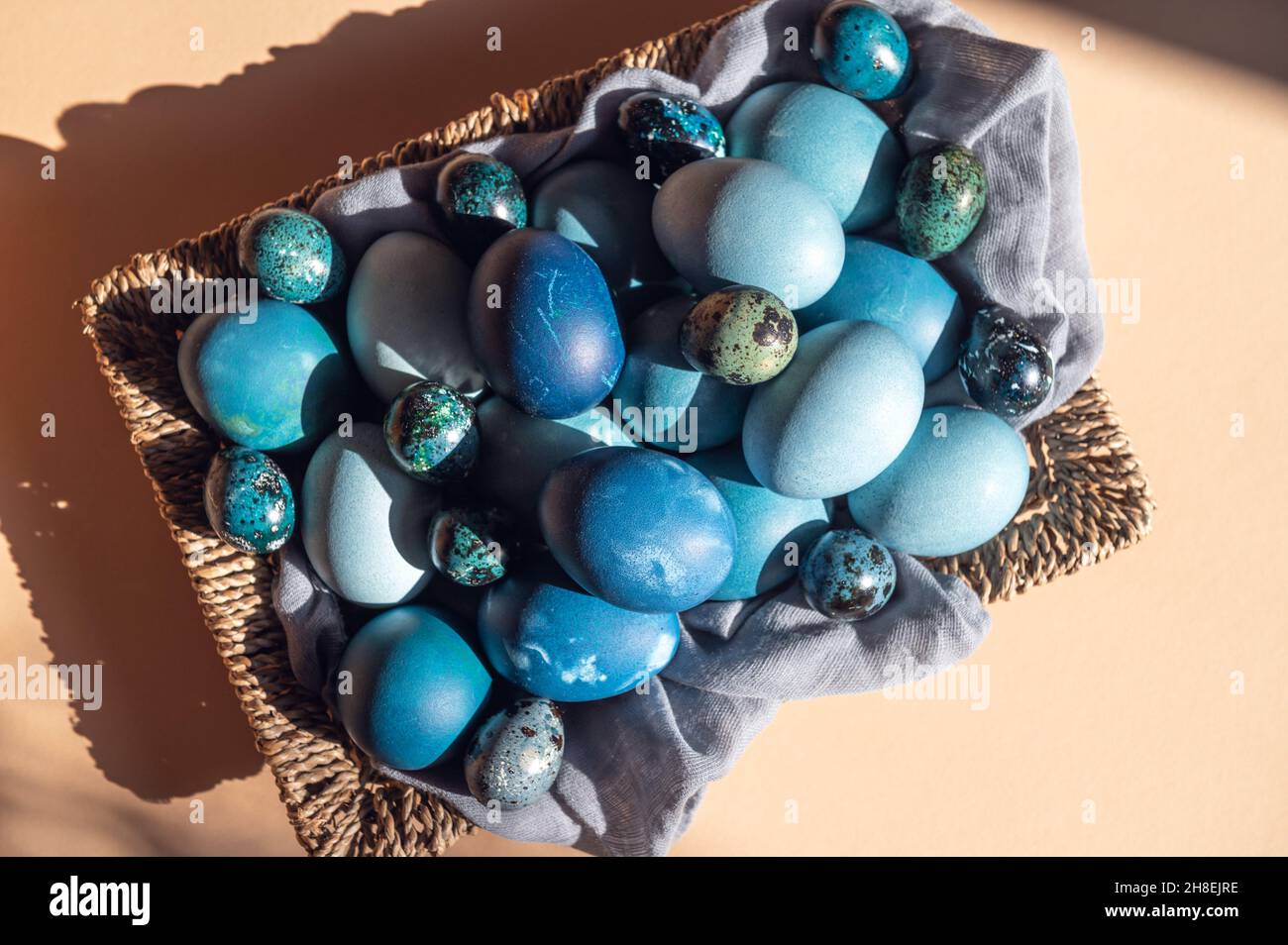 Homemade naturally dyed eggs in blue colors Stock Photo - Alamy