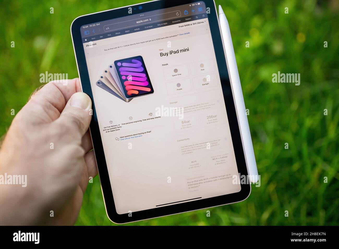 Apple Pencil stylus pen in male hand showing the buy the object menu on ...