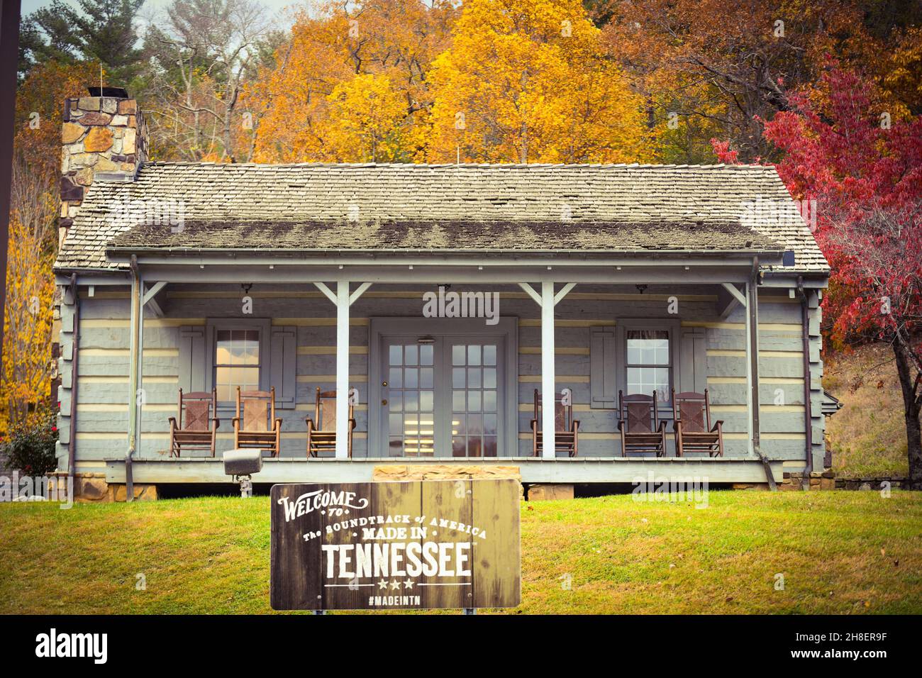 Wooden "Welcome to Tennessee" sign in front of a cabin near the ...