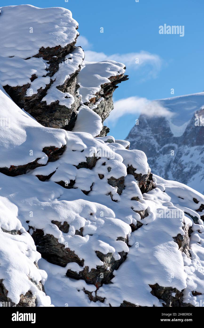 Vertical shot of a geological formation covered in snow in Matterhorn ...