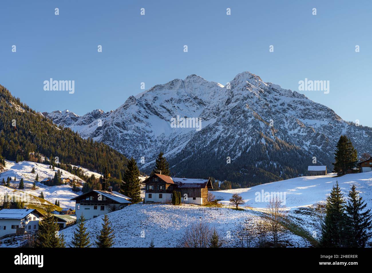 Scenic view of a snowy mountain on a clear sky background Stock Photo ...