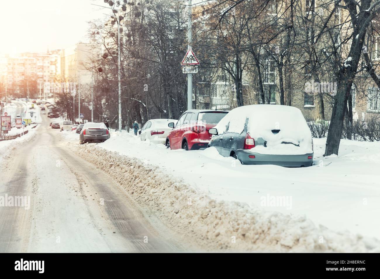 Empty city road covered by dirt melted snow sludge after heavy snowfall ...