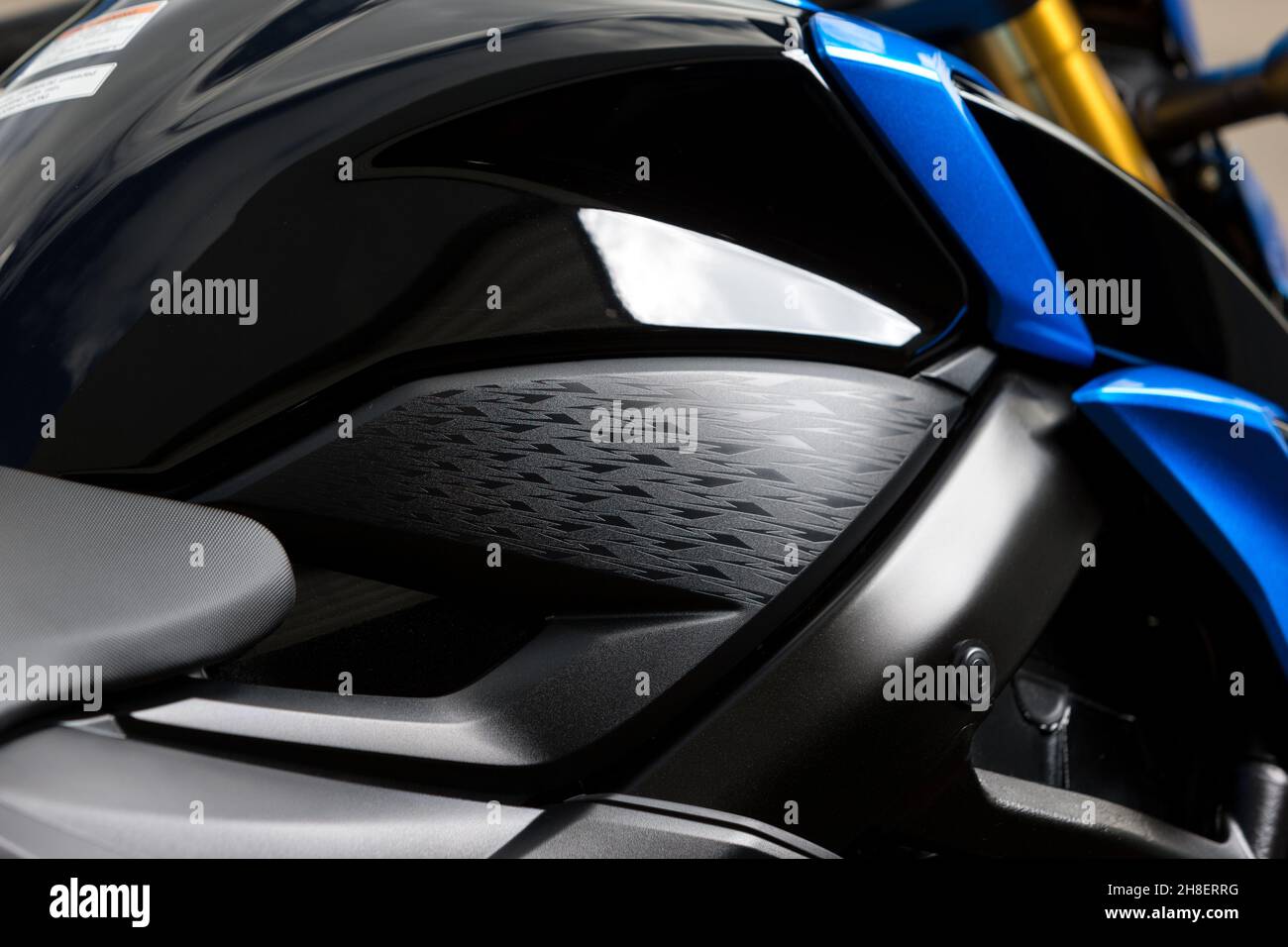 Closeup of the details of a modern motorcycle outdoors in the daylight ...