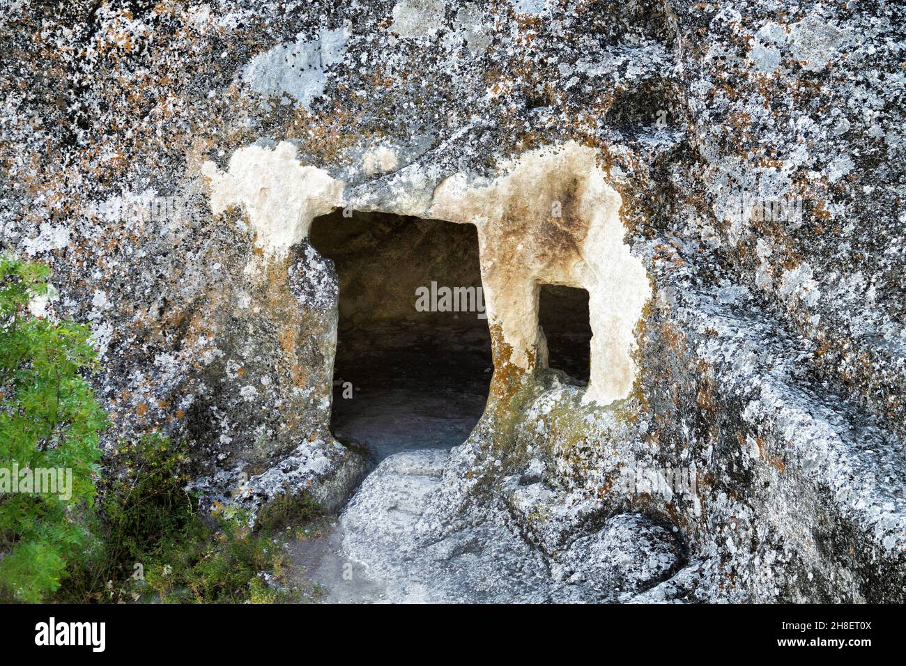 Entrance to a man-made cave in a limestone rock. A place of refuge for ...