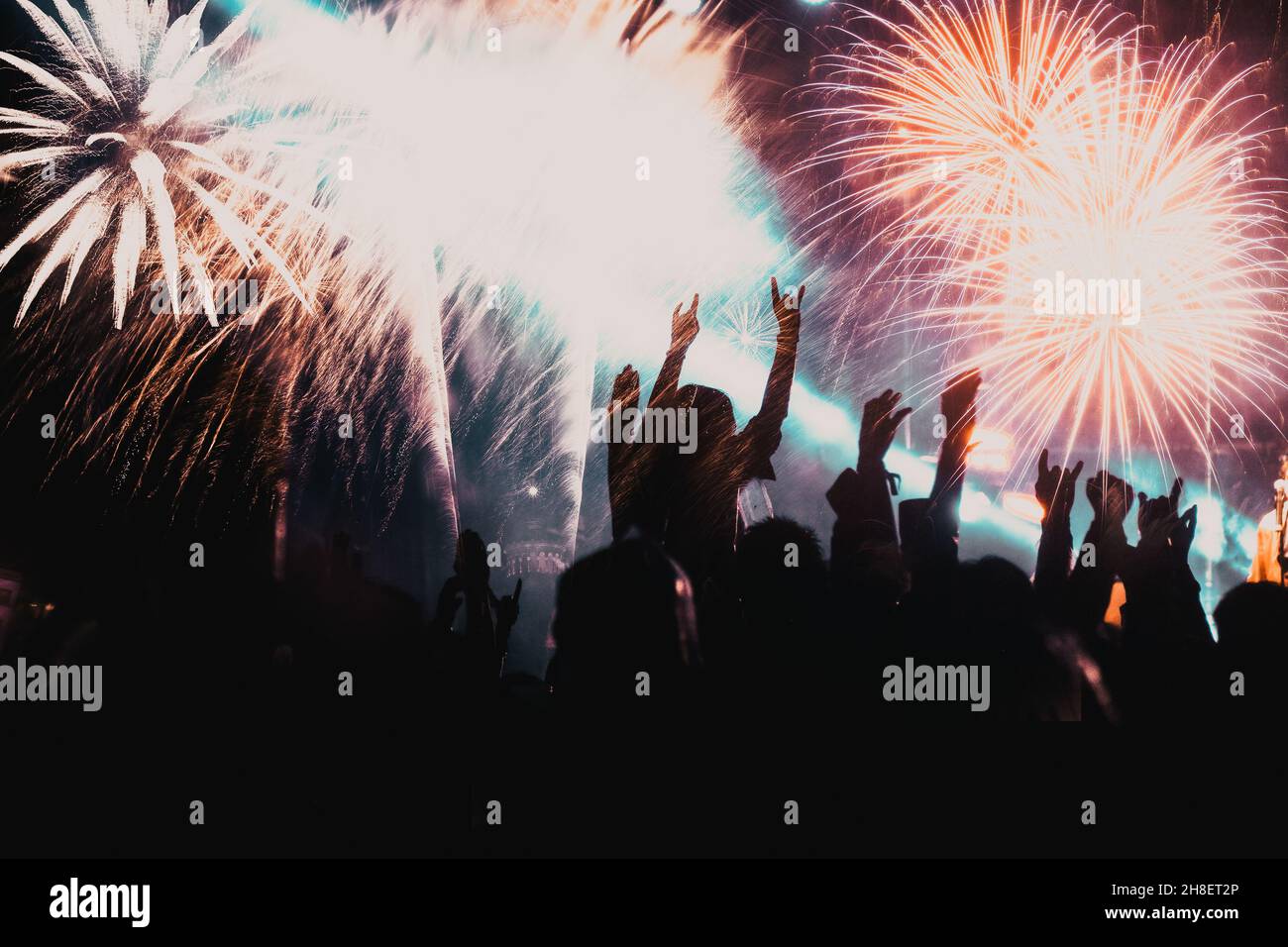 cheering crowd watching fireworks at New Year - holiday celebration ...