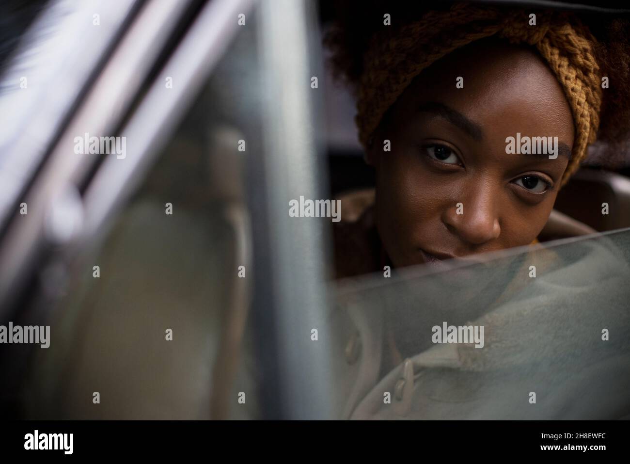 Close up portrait beautiful young woman in car window Stock Photo - Alamy