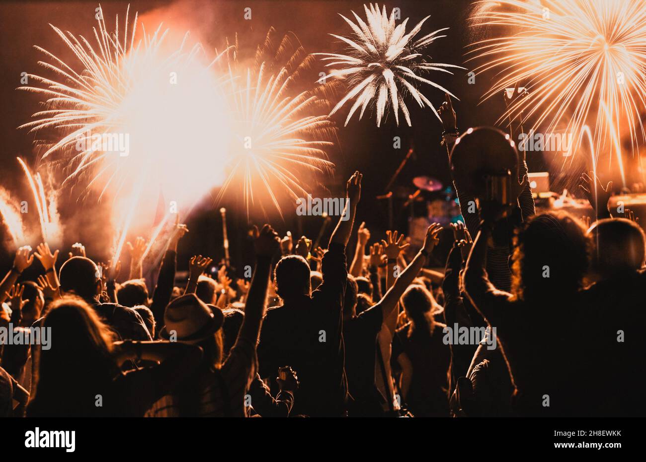 Cheering crowd watching fireworks at New Year Stock Photo - Alamy