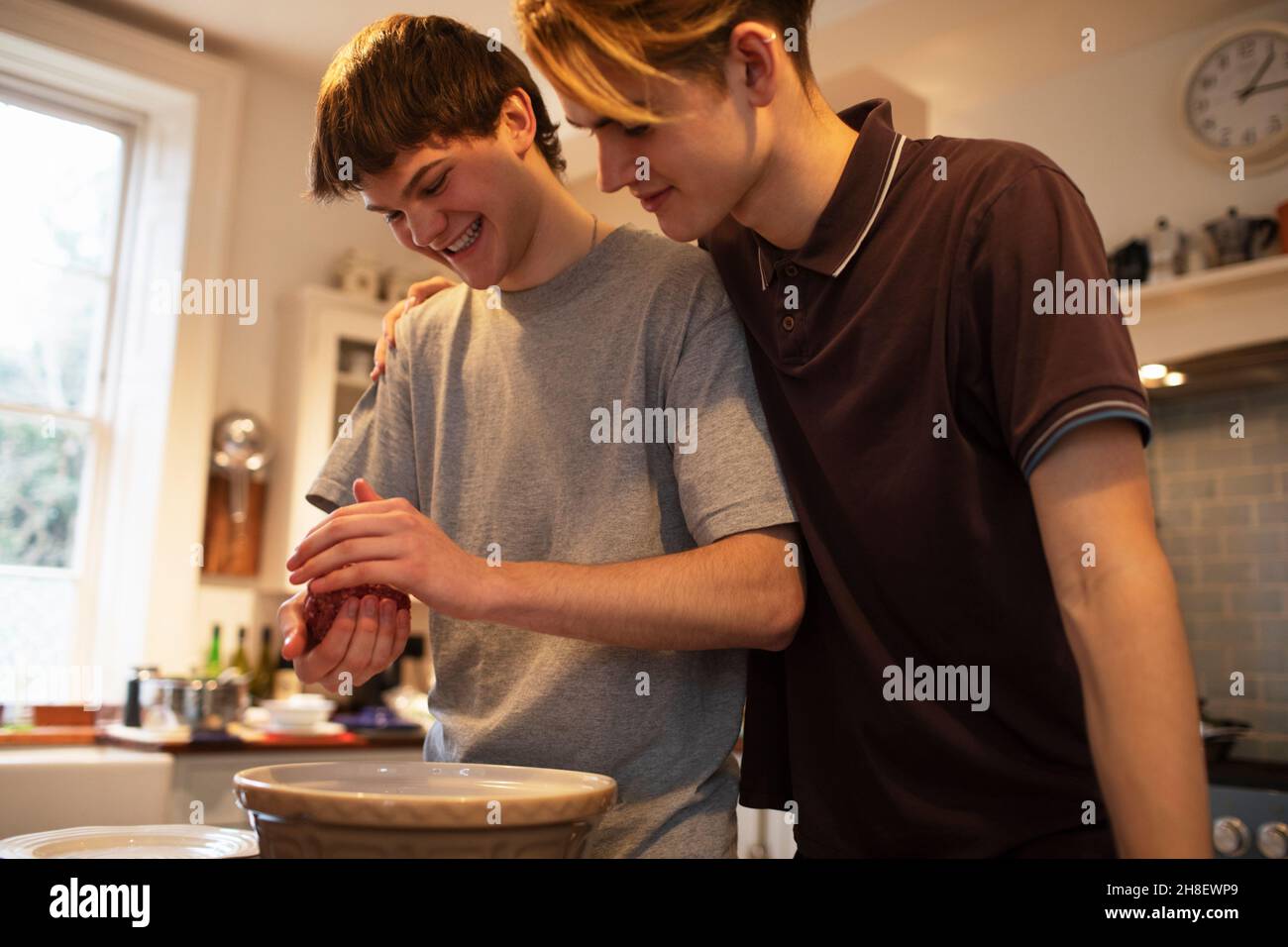 Teenage boys cooking in kitchen Stock Photo - Alamy