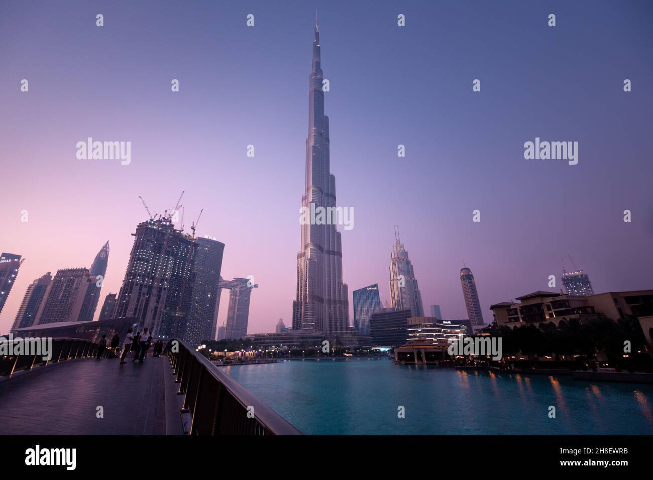 Burj, dubai mall and surroundings, a city shrouded in light, tourists ...