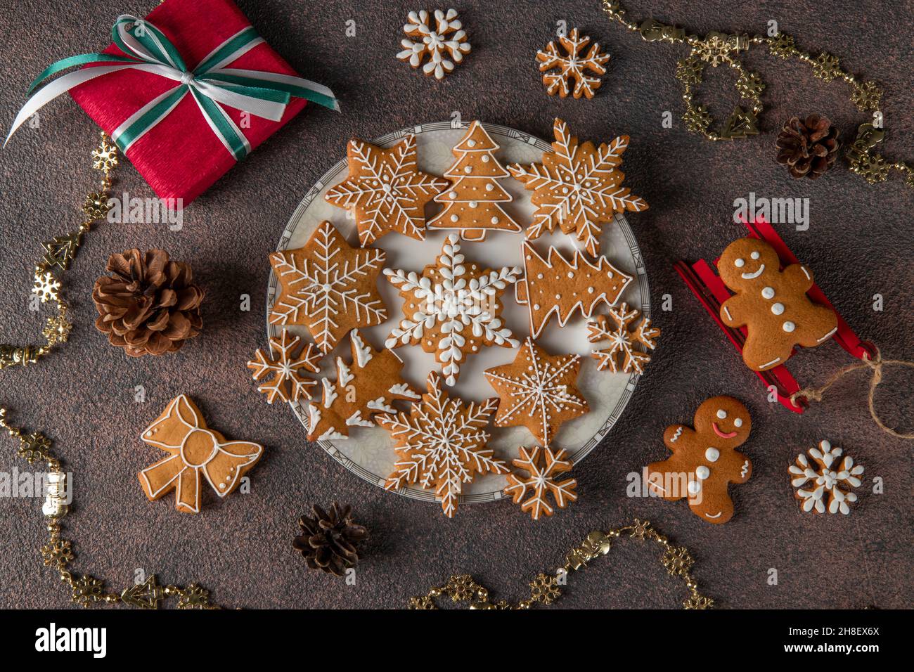 Cookies in shaped of christmas tree, gingerbread man and snowflakes on ...